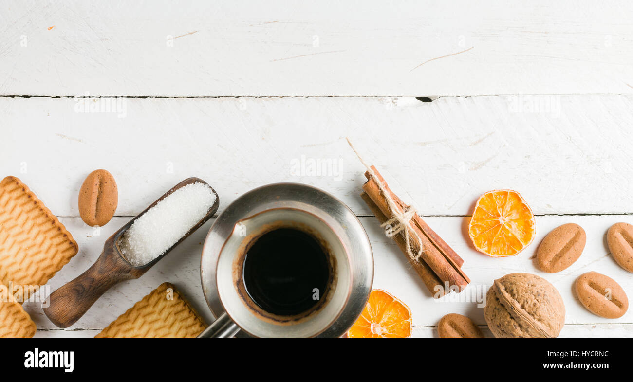 Morning tea with fruit and candied fruit. White wooden background and ...