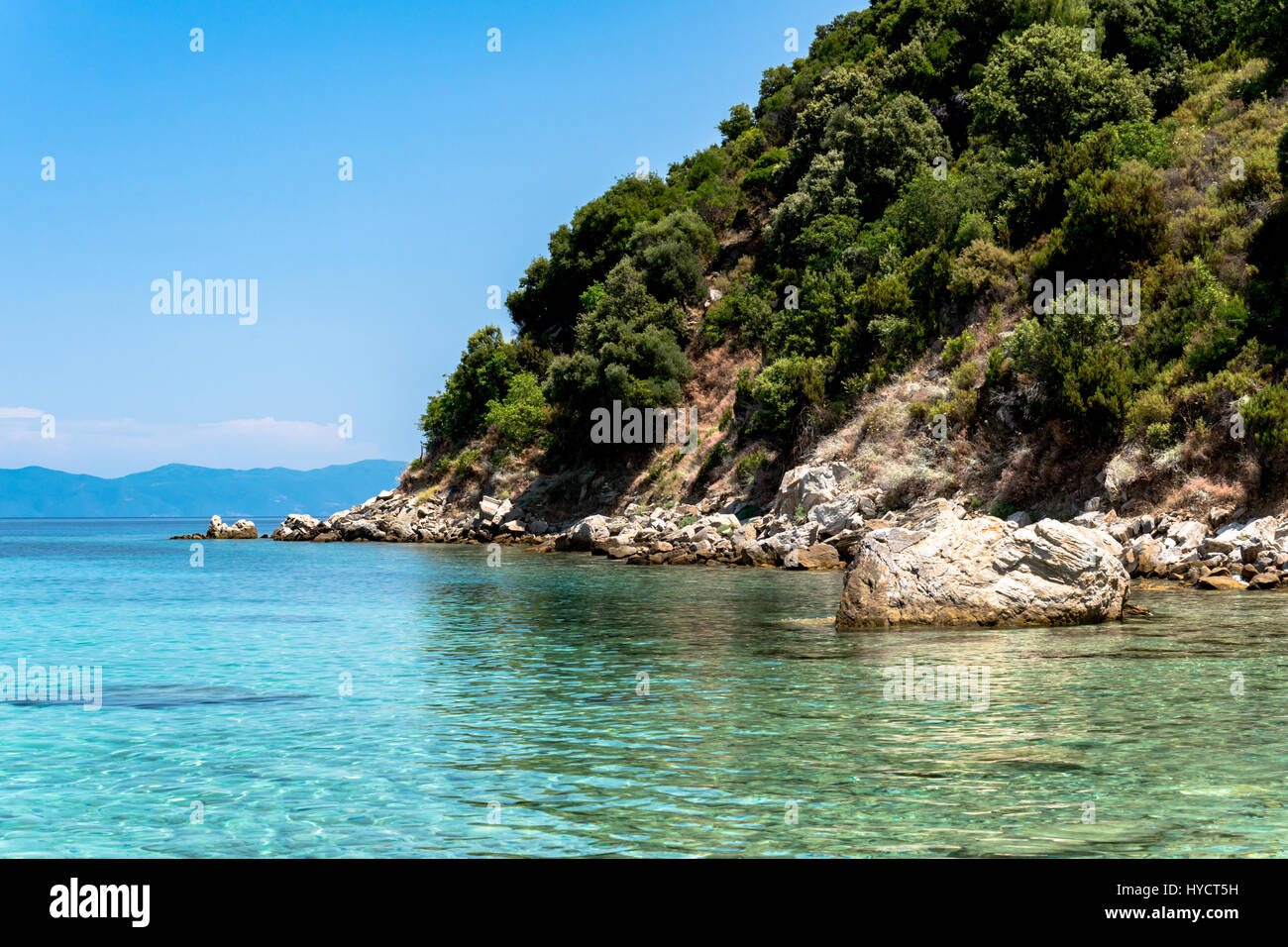 Exotic blue sea lagoon at Greece, mount Athos in the background Stock ...