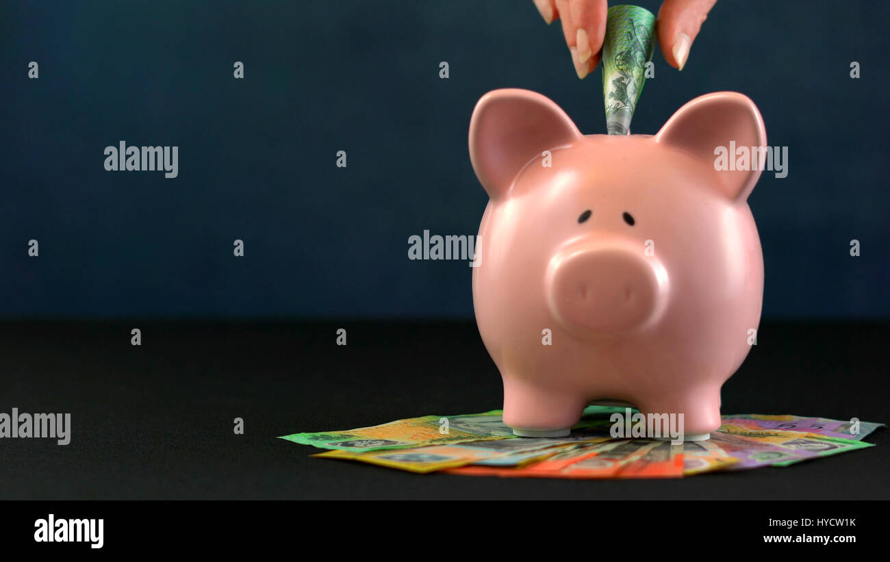 Australian money woman piggy bank hi-res stock photography and images ...