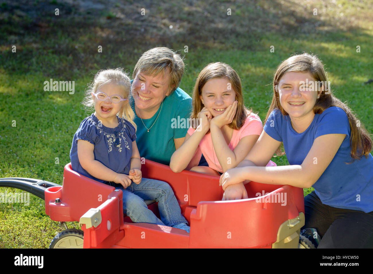 Family with child with down syndrome hi-res stock photography and ...