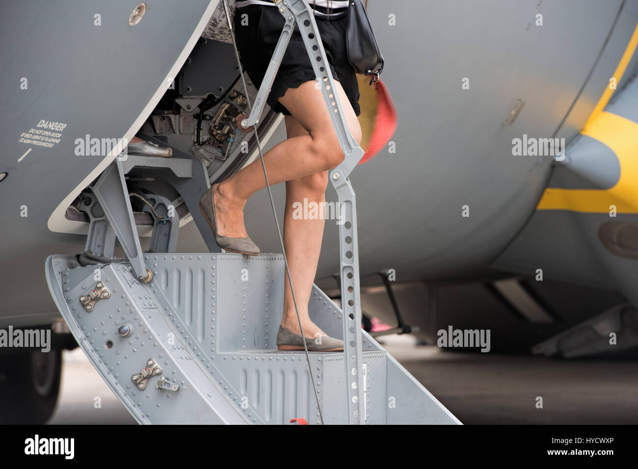 woman coming out a plane Stock Photo - Alamy