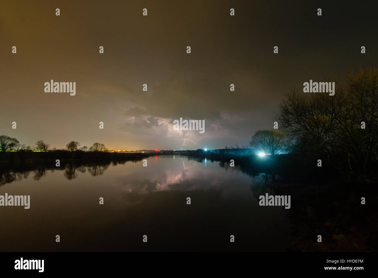 Rain and lightning above the river Stock Photo - Alamy