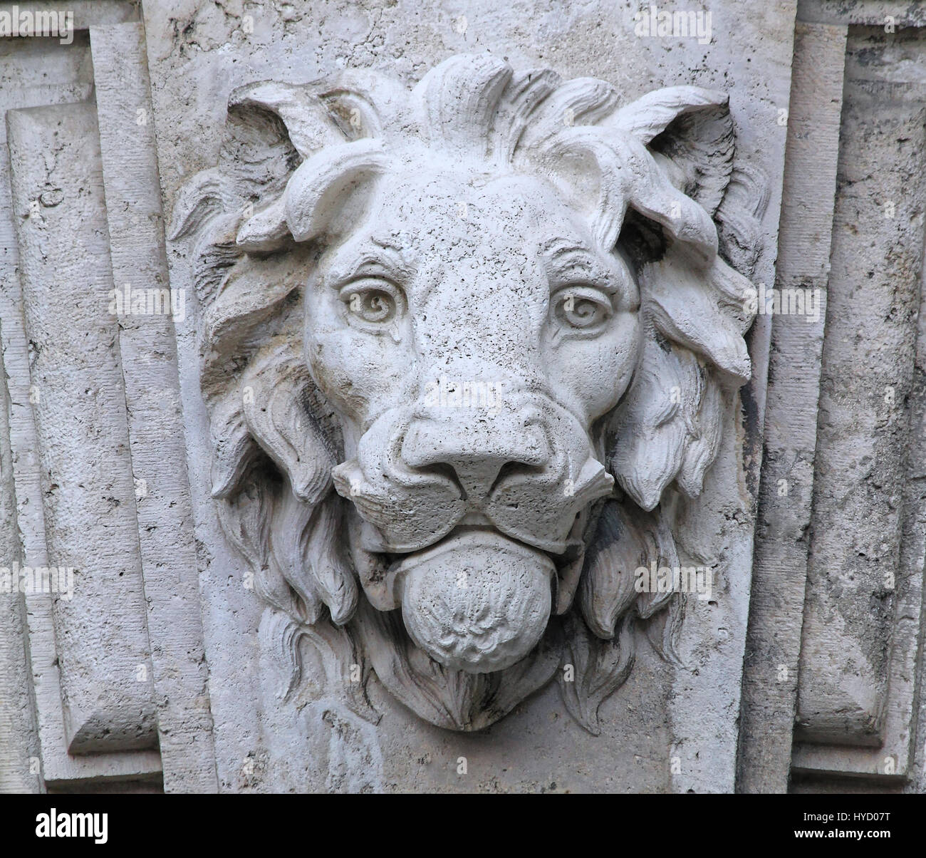 Castle building is decorated with carved stone face Stock Photo - Alamy