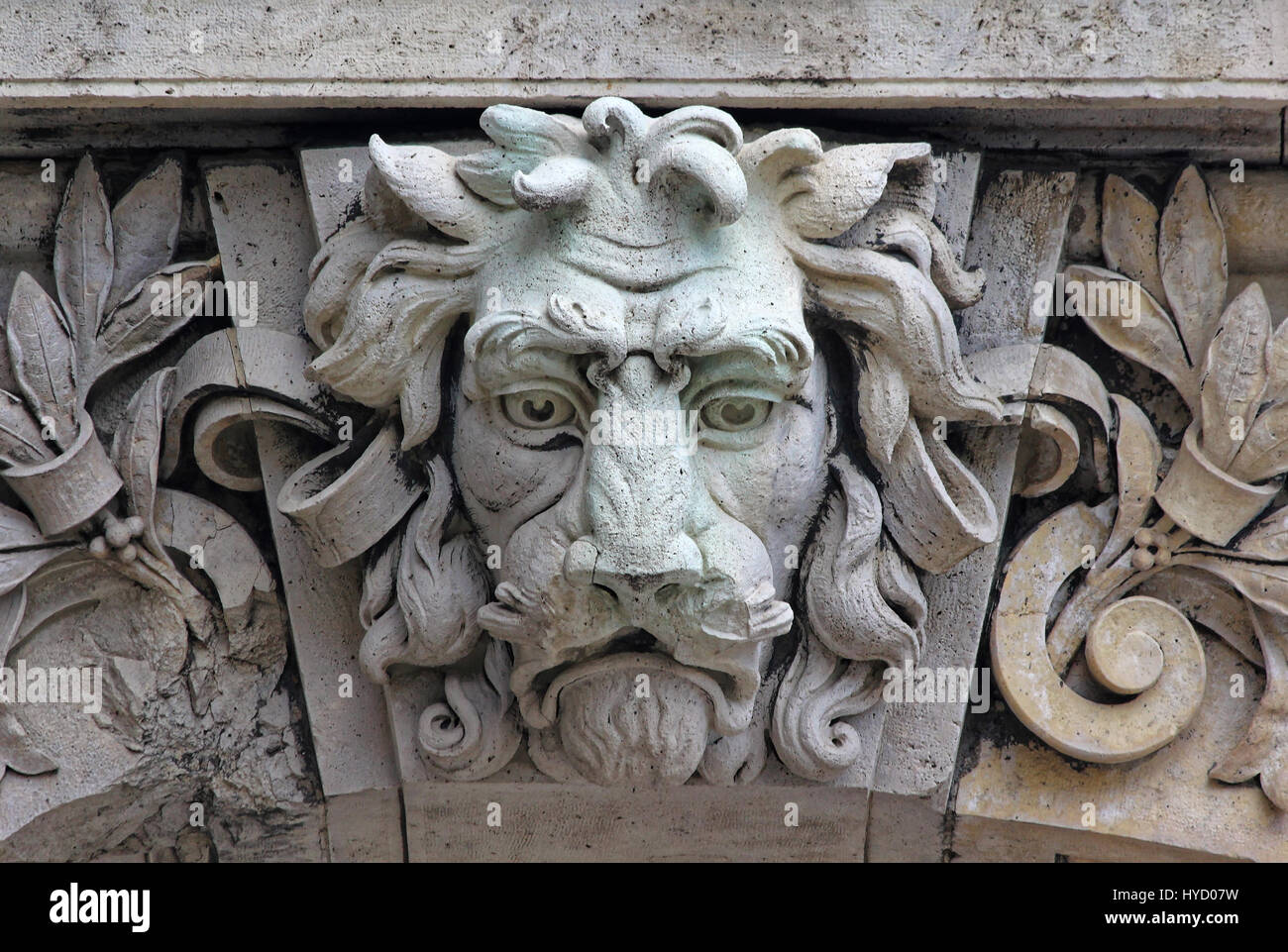 Castle building is decorated with carved stone face Stock Photo - Alamy