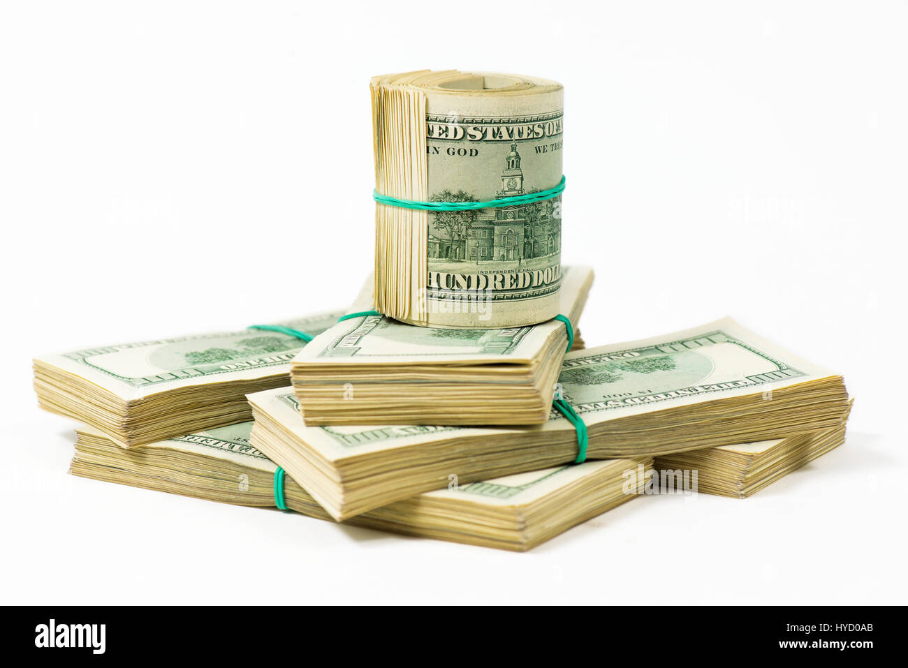 A twisted bundle of 100 dollar bills stands on packs of dollars Stock ...