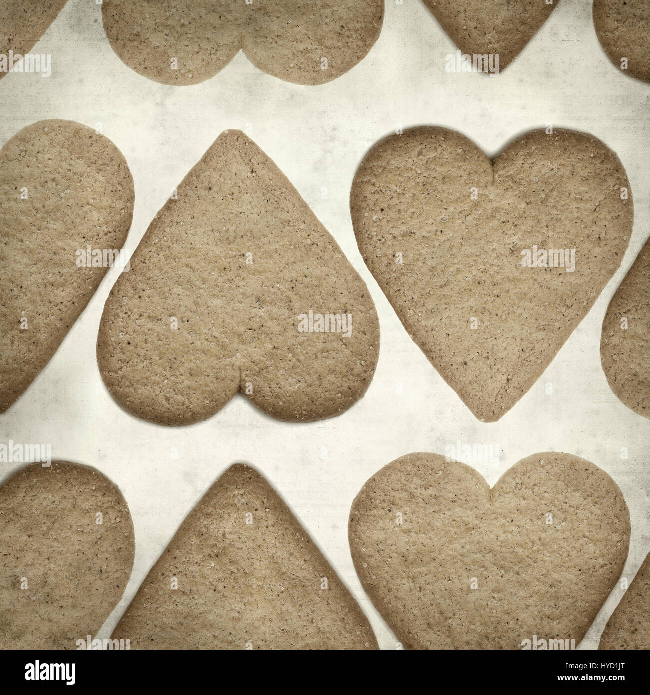 textured old paper background with ginder thin cookie shaped like a ...