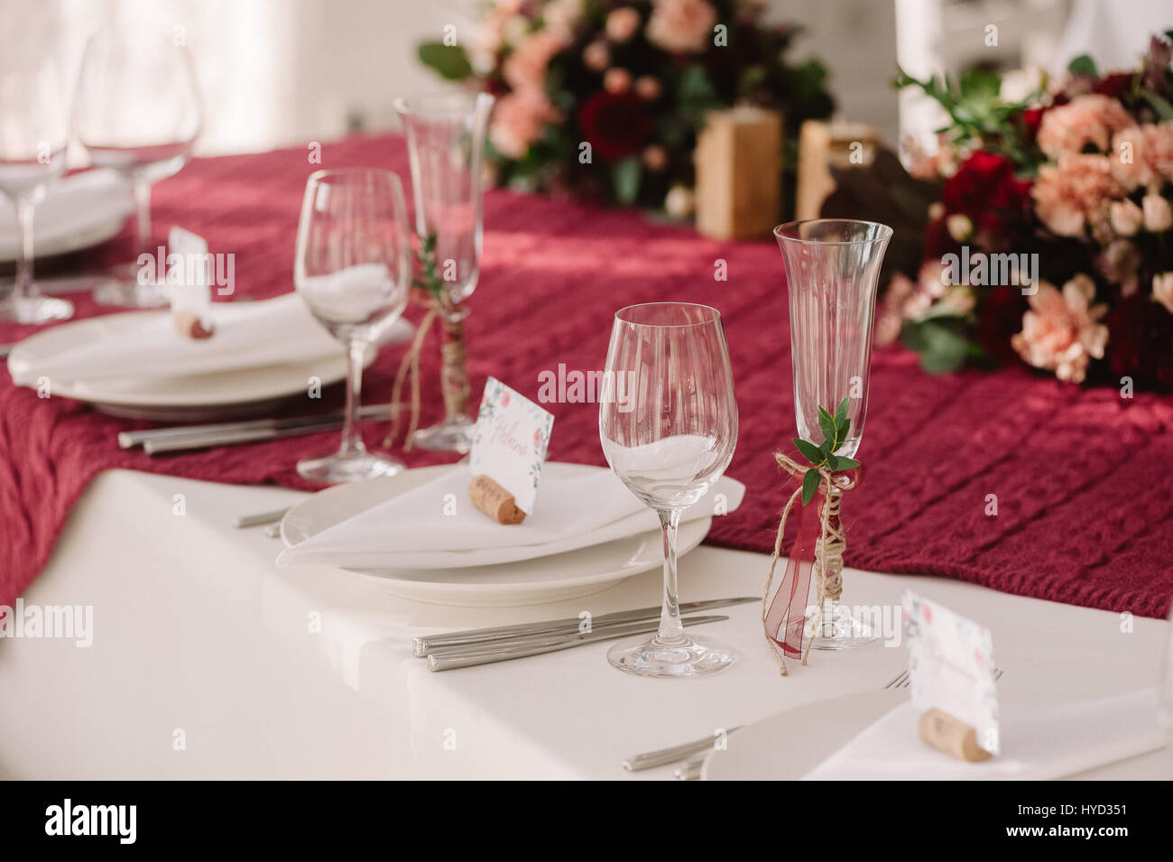 Wedding table decoration on the red cloth Stock Photo - Alamy