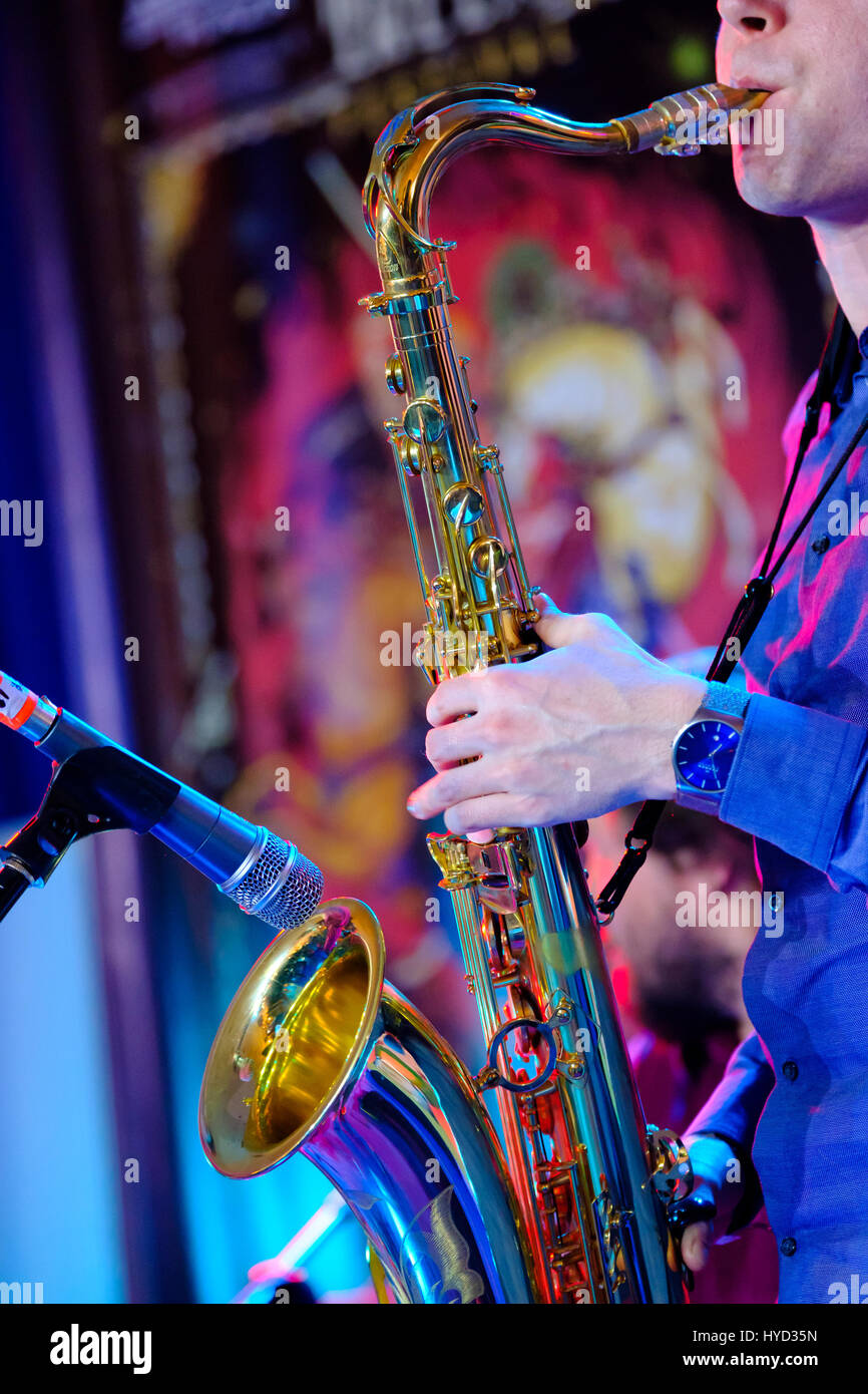 Musician plays the saxophone at the stage Stock Photo - Alamy