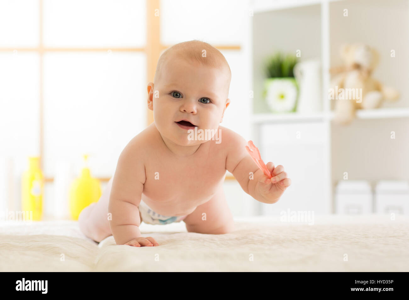 cute crawling baby girl at home Stock Photo - Alamy