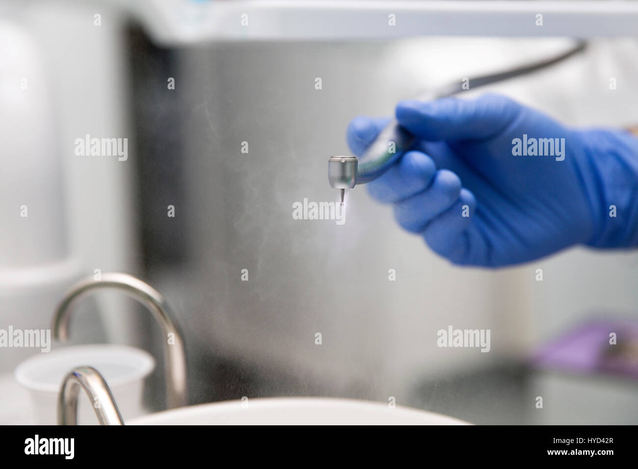 Grinder for teeth in a dentist's hand Stock Photo - Alamy