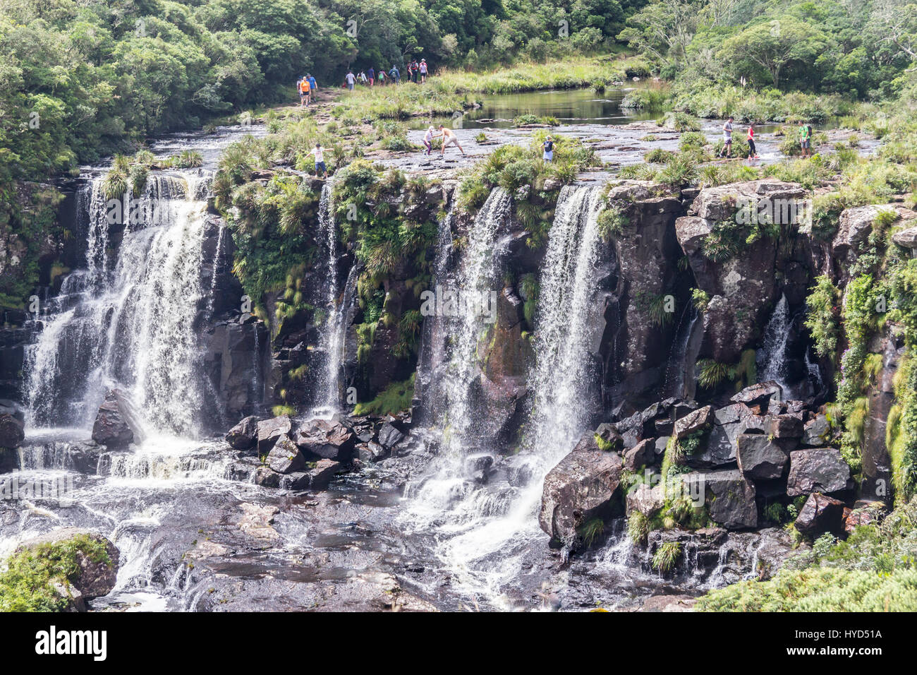 People crossing Canyon waterfall in Cambara do Sul, Rio Grande do Sul ...