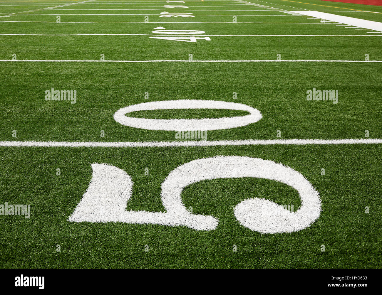 Football field marking of 50 yard line Stock Photo - Alamy