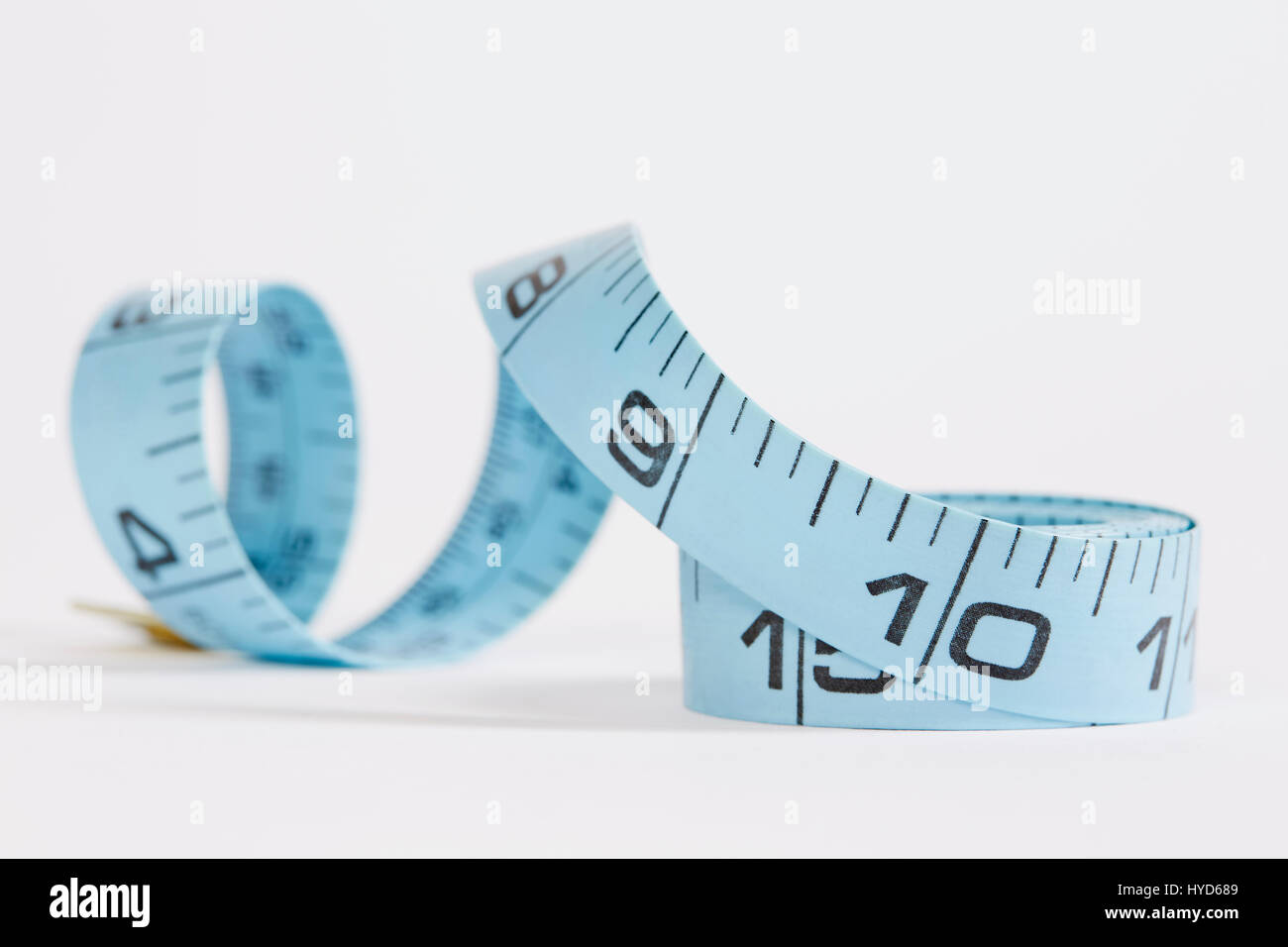 Blue measuring tape on white background Stock Photo - Alamy
