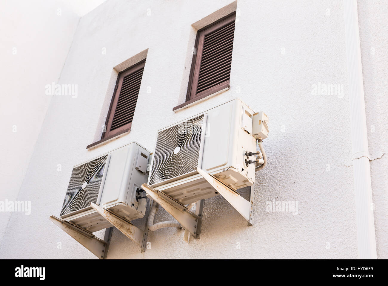 Air conditioner compressor installed in building Stock Photo - Alamy