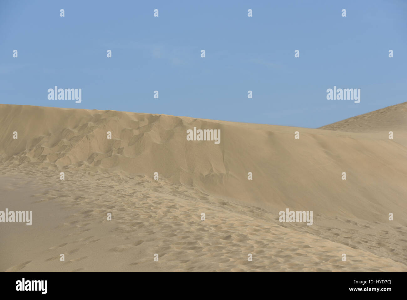 Sand dunes scenery with blue sky Stock Photo - Alamy