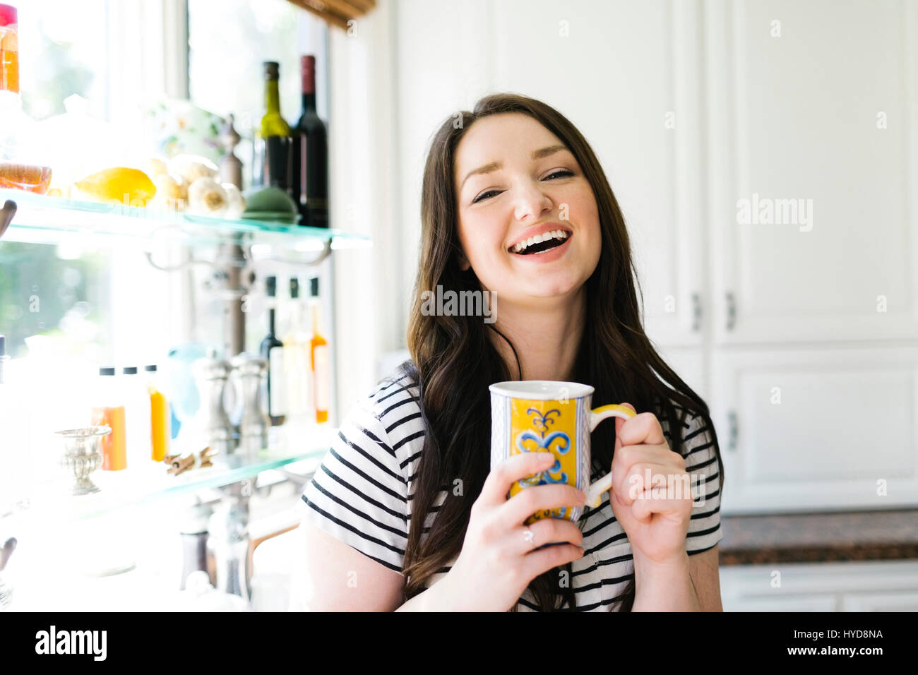 Woman drinking coffee at home Stock Photo - Alamy