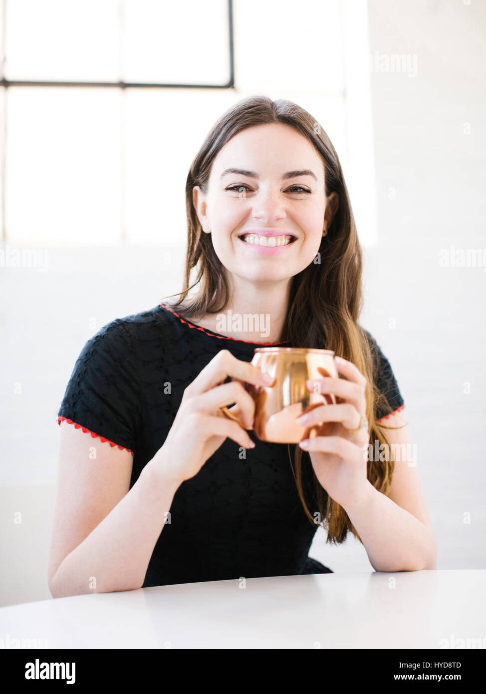 Woman drinking hot chocolate Stock Photo - Alamy