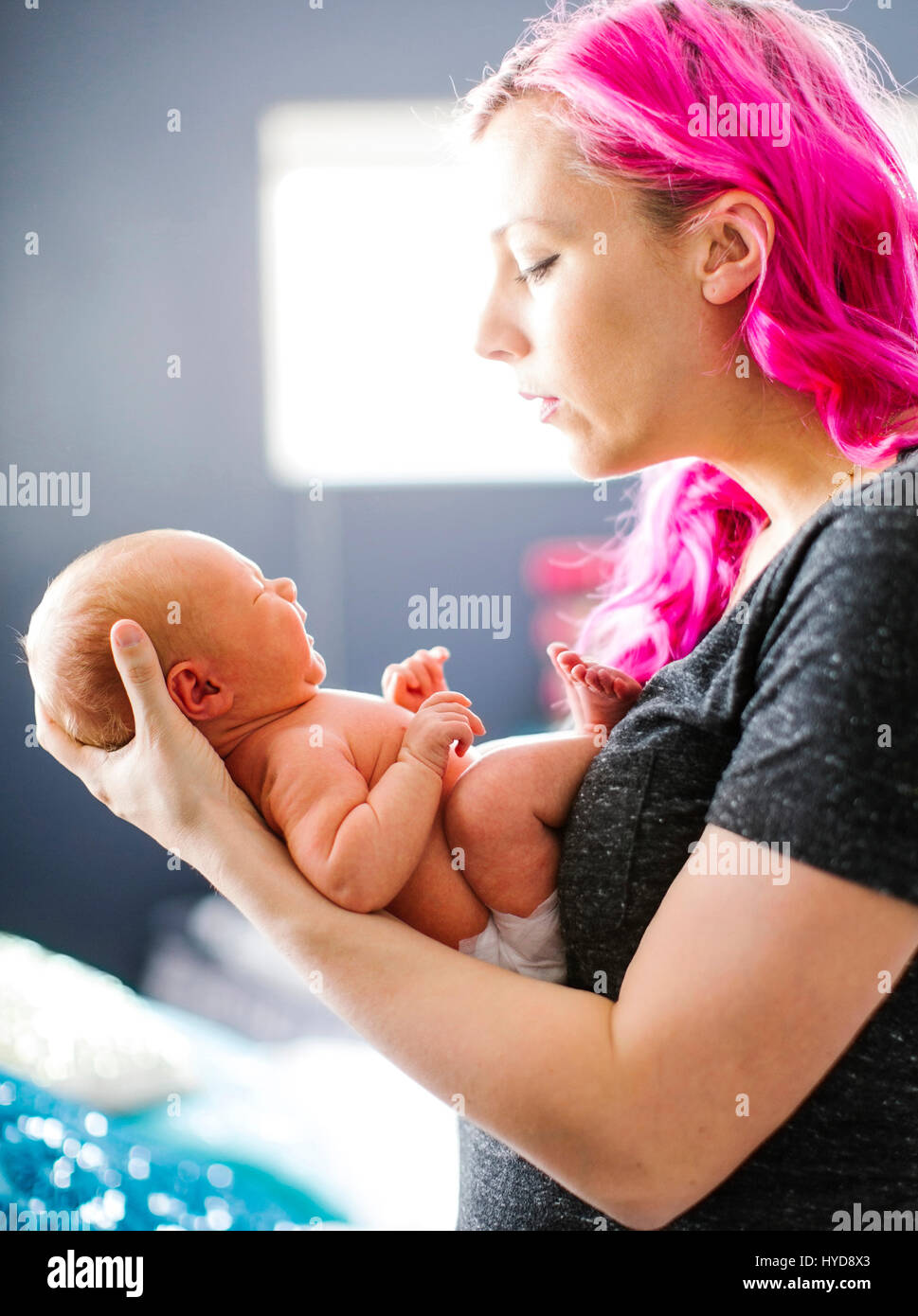 Mother holding newborn son (2-5 months Stock Photo - Alamy