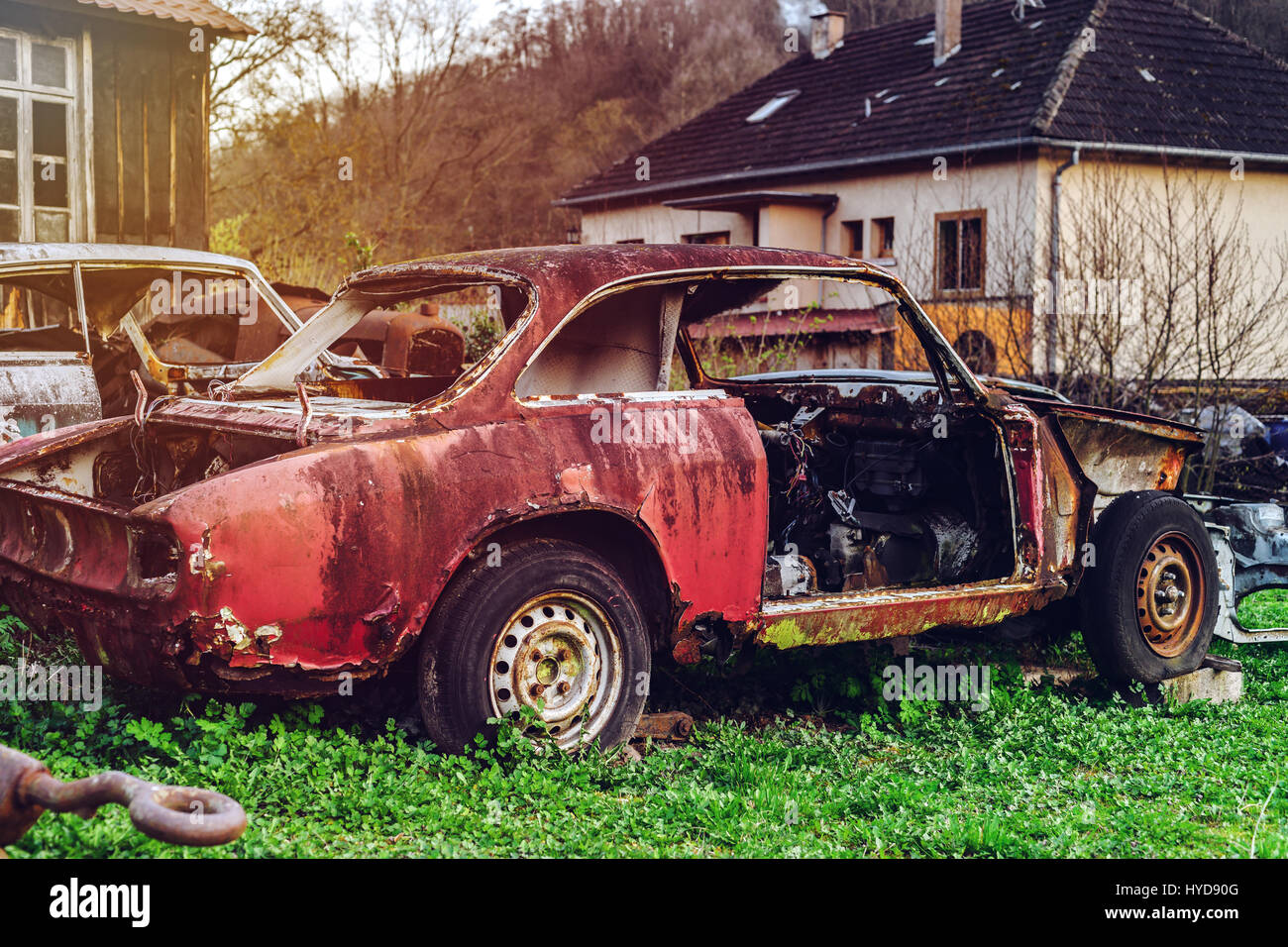 Abandoned old rusty body and parts of retro car, outdoor Stock Photo ...