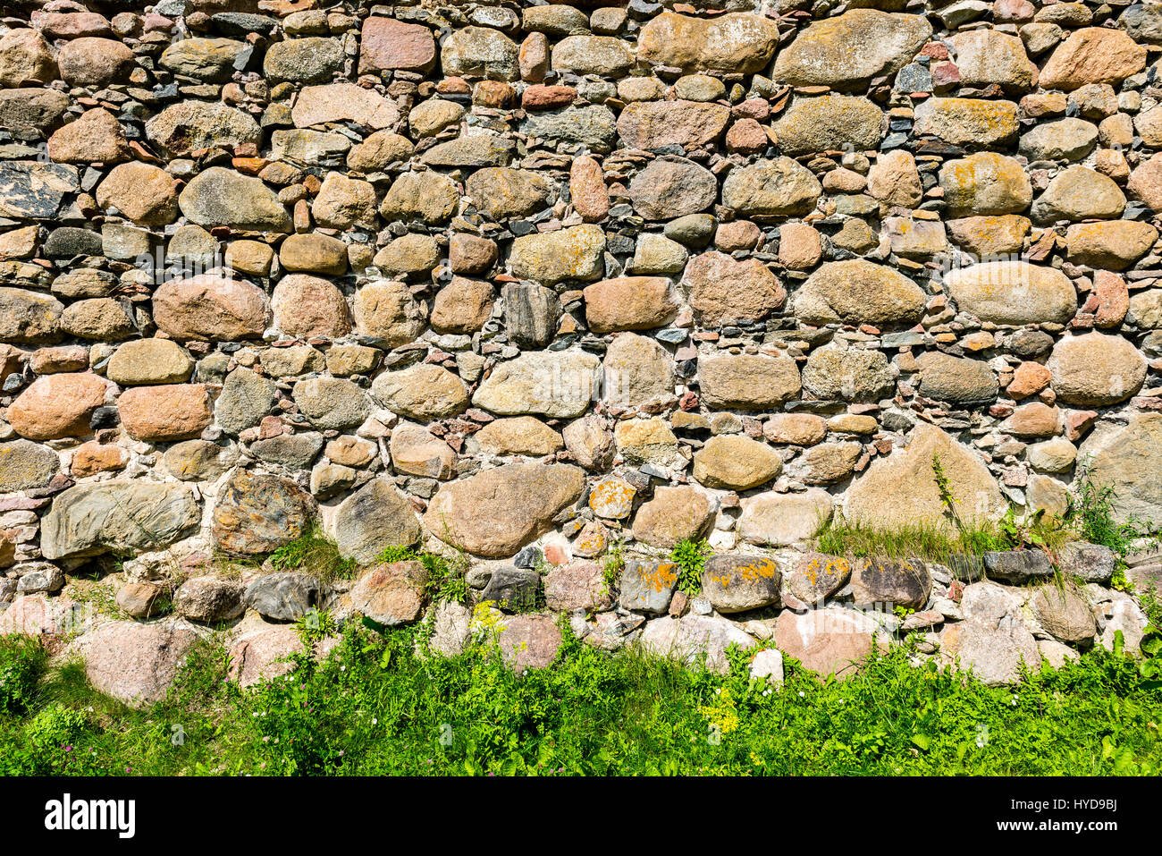 ancient stone brick wall background texture with green grass Stock ...