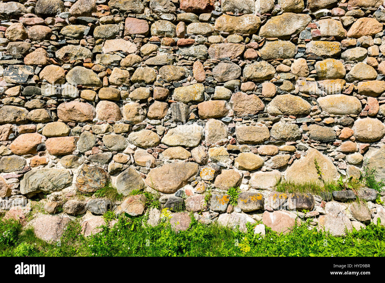 ancient stone brick wall background texture with green grass Stock ...