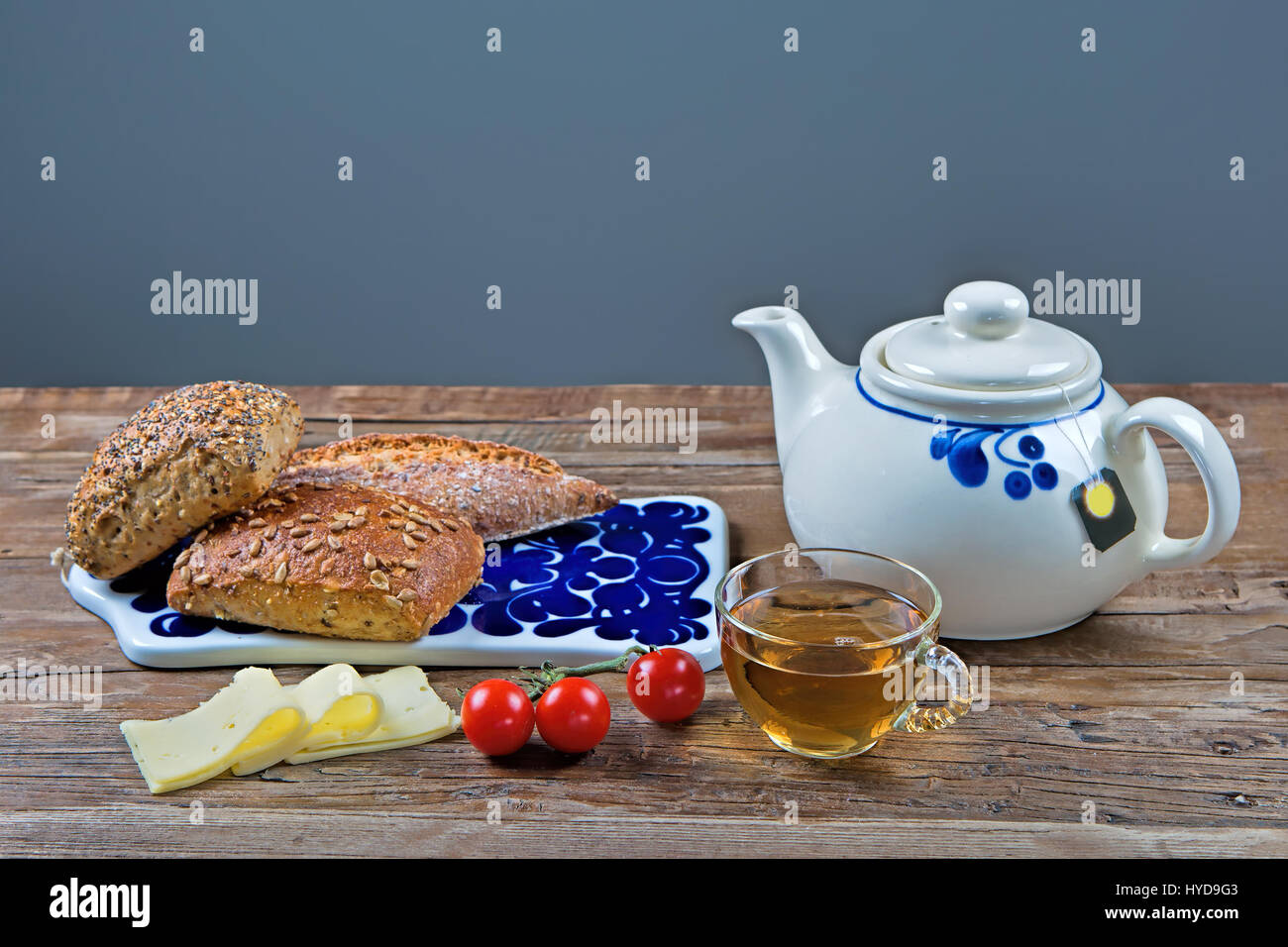 Studio shot of rolls and tea on a breakfast table Stock Photo - Alamy