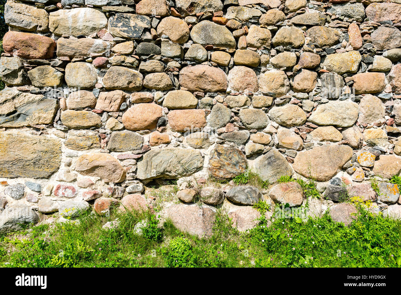 ancient stone brick wall background texture with green grass Stock ...