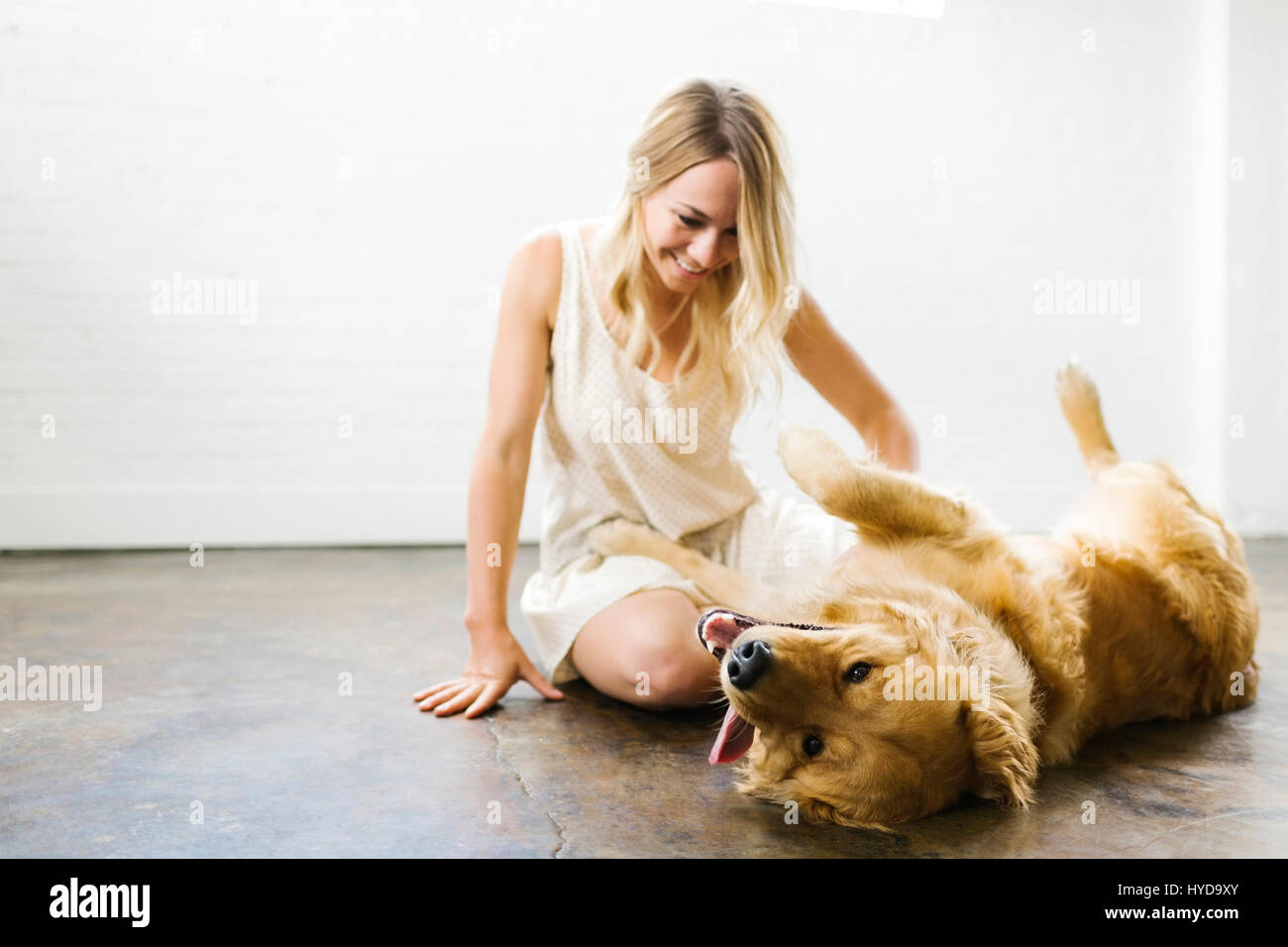 Woman sitting stroking dog hi-res stock photography and images - Alamy