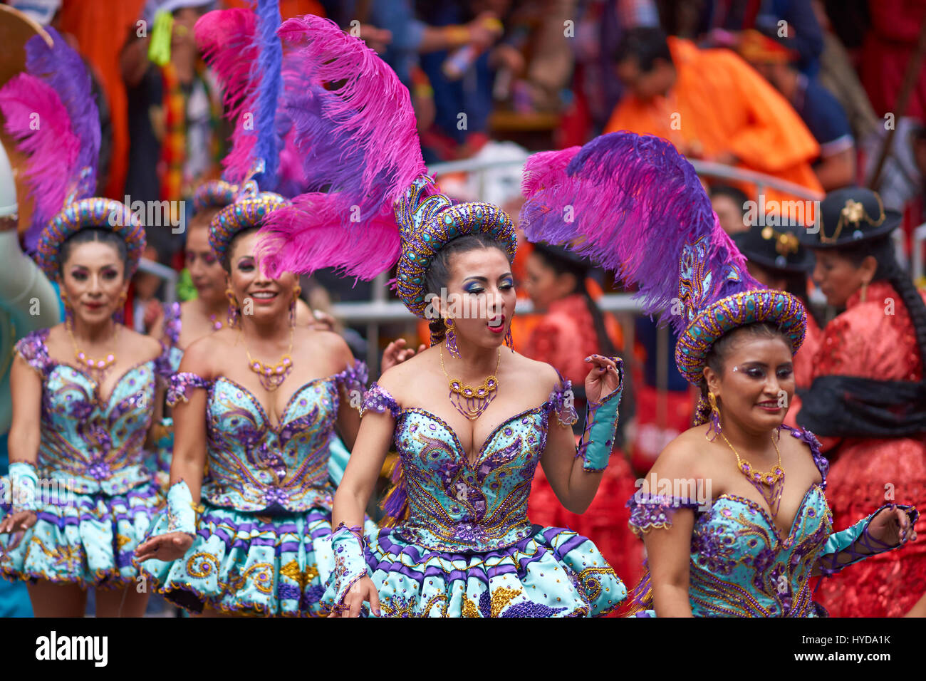 Morenada dancers in ornate costumes parading through the mining city of ...
