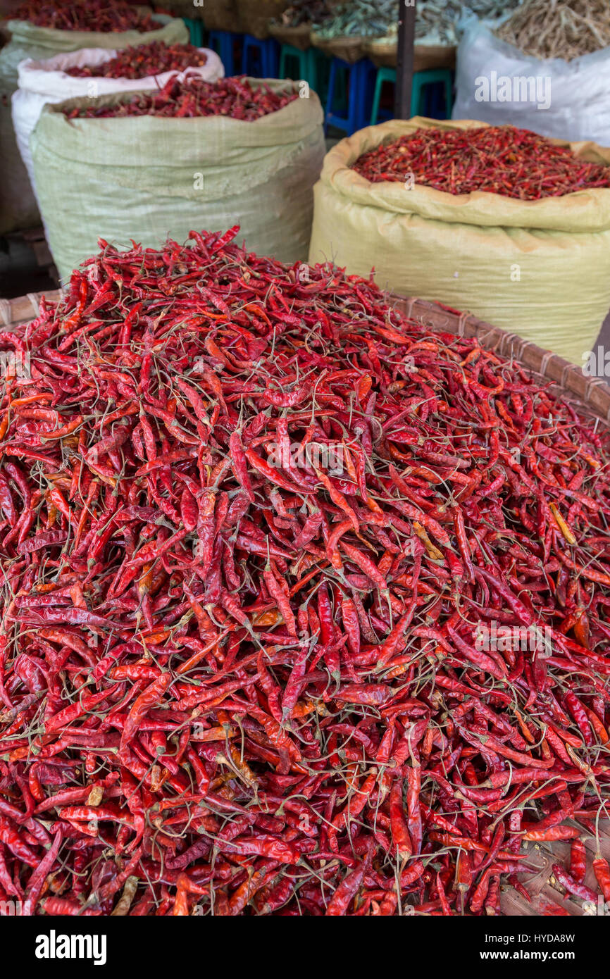 A lot of dried chilies in a woven basket and sacks at the Zegyo (also ...