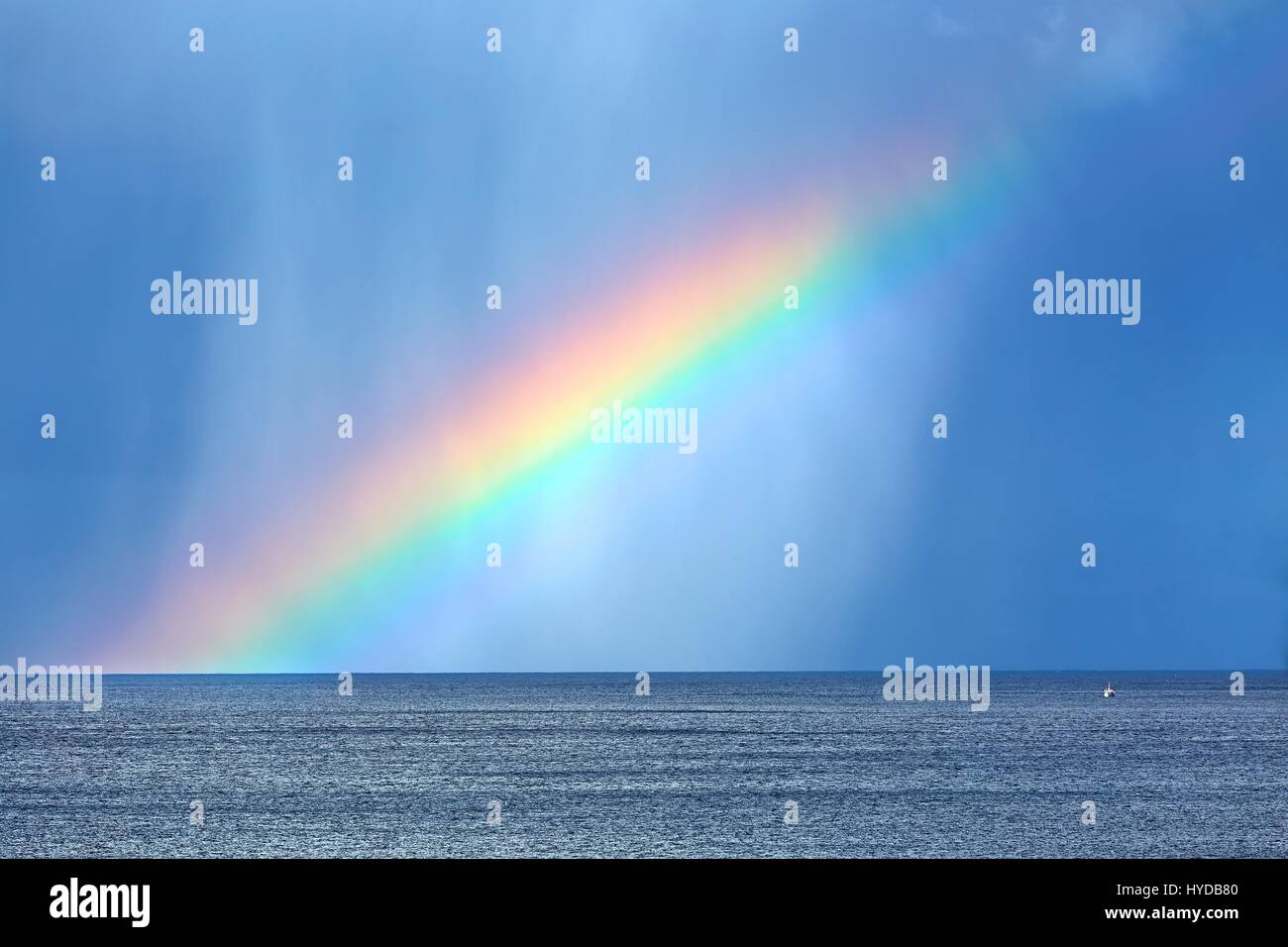 Rainbow over sea Stock Photo - Alamy