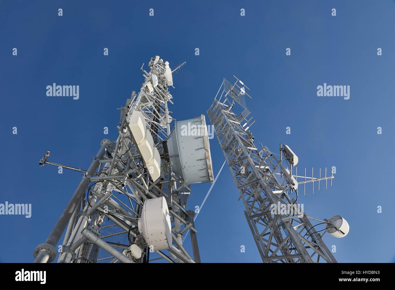 Transmitter towers, blue sky Stock Photo - Alamy