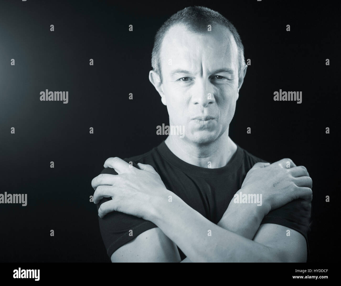 Attractive handsome slim healthy man aged in 40's in black t-shirt ...
