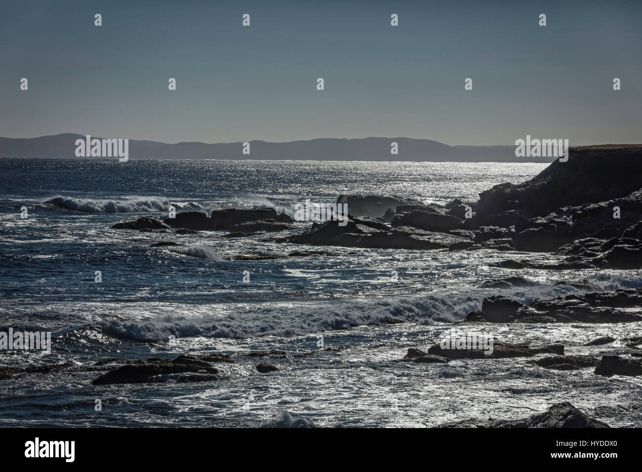 Atlantic Ocean waves breaking against the rocks off Adam's Cove in ...