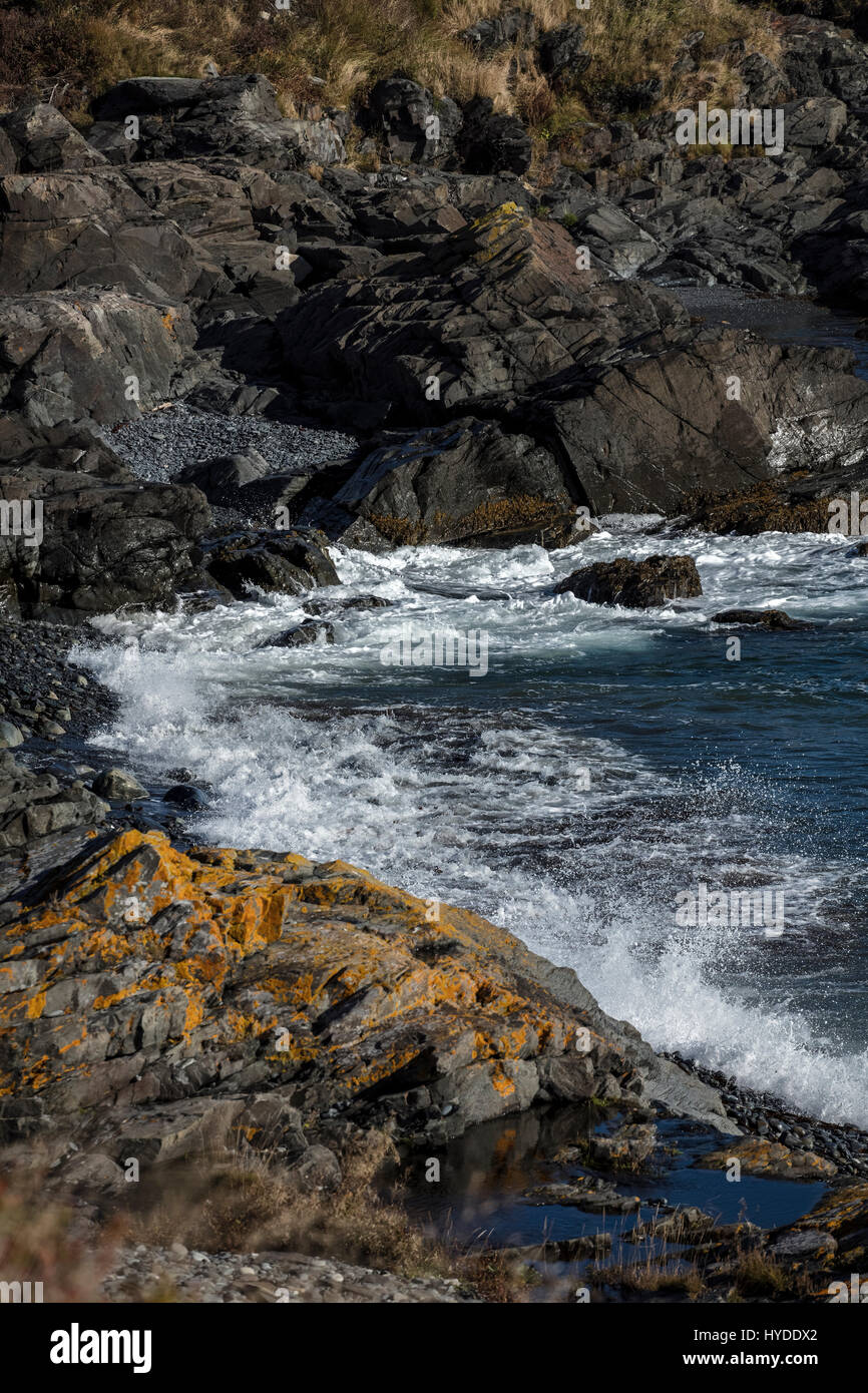 Rough sea with waves from the Atlantic Ocean hitting the rocks on the ...