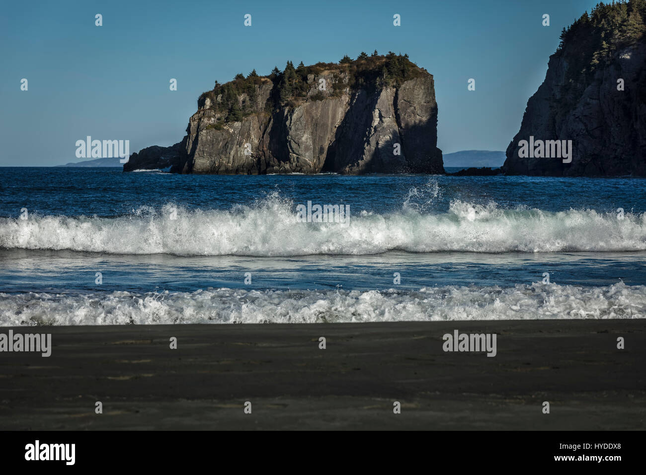 White waves near the beach in Newfoundland Canada with rocks in the ...