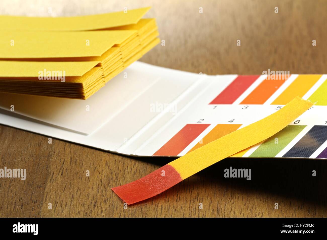 universal indicator paper with acidic testing Stock Photo - Alamy