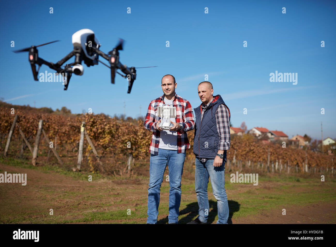 Two young men wireless manages drone's flight Stock Photo - Alamy