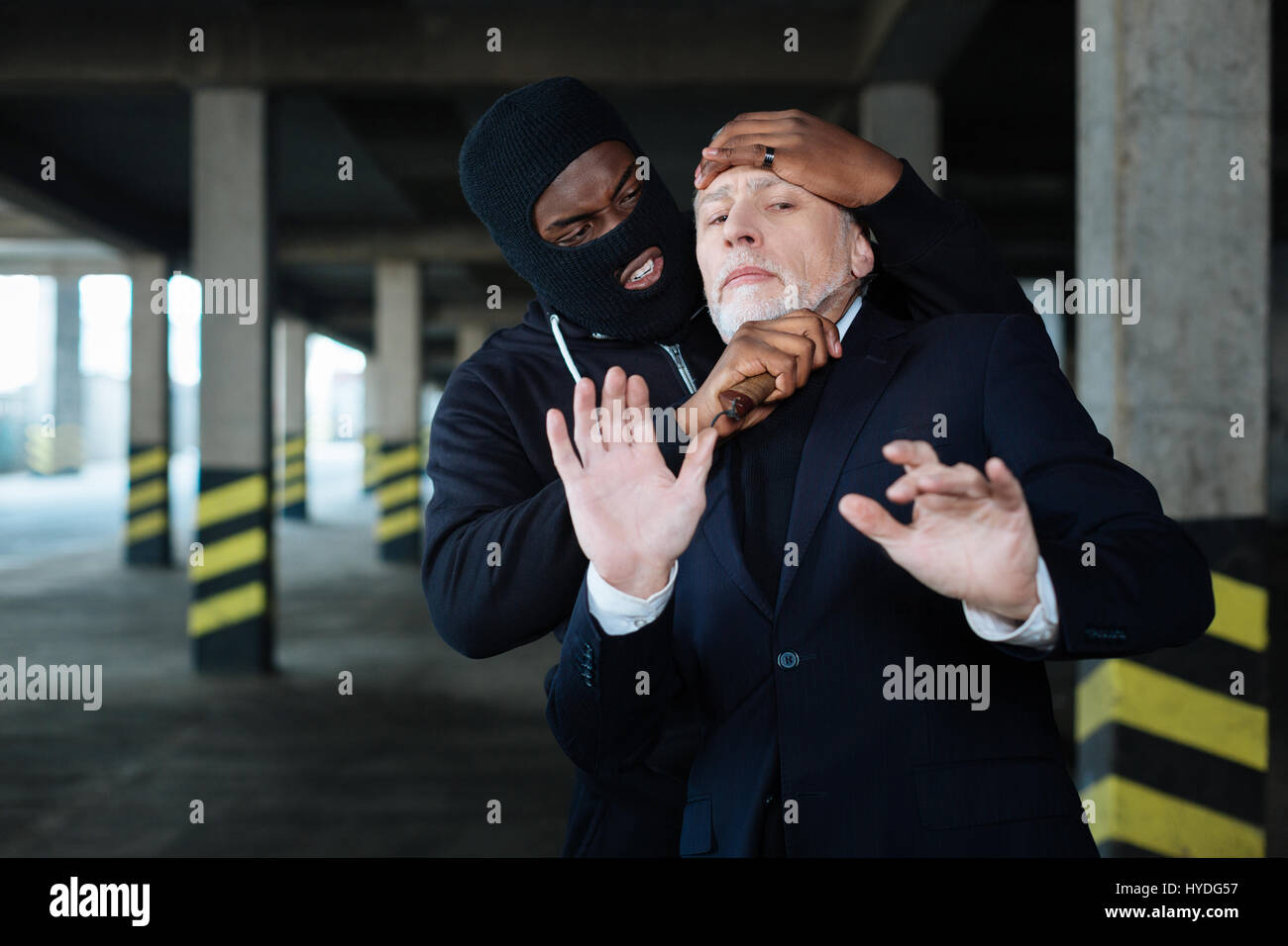 Angry aggressive man holding a knife Stock Photo - Alamy