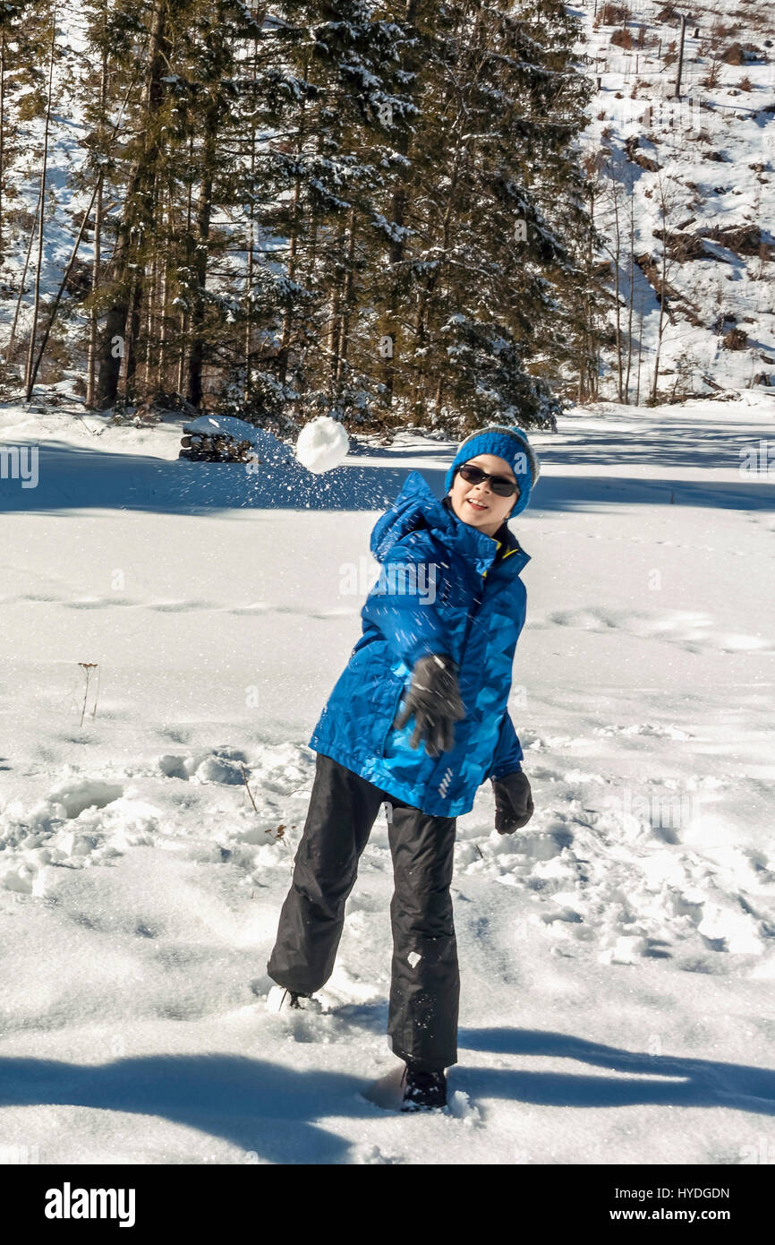 Boy is throwing snowball hi-res stock photography and images - Alamy