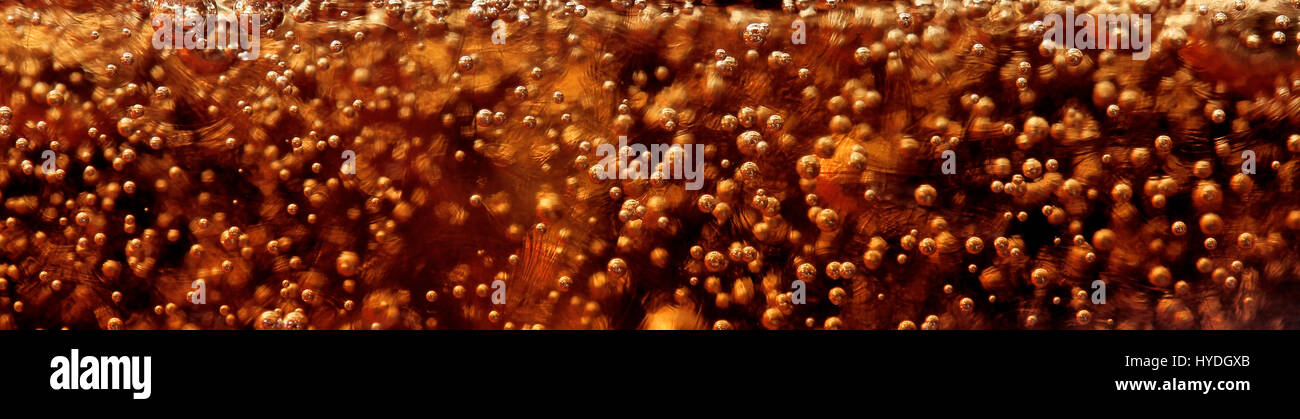 Macro shot of coca-cola bubbles with ice cubes Stock Photo - Alamy