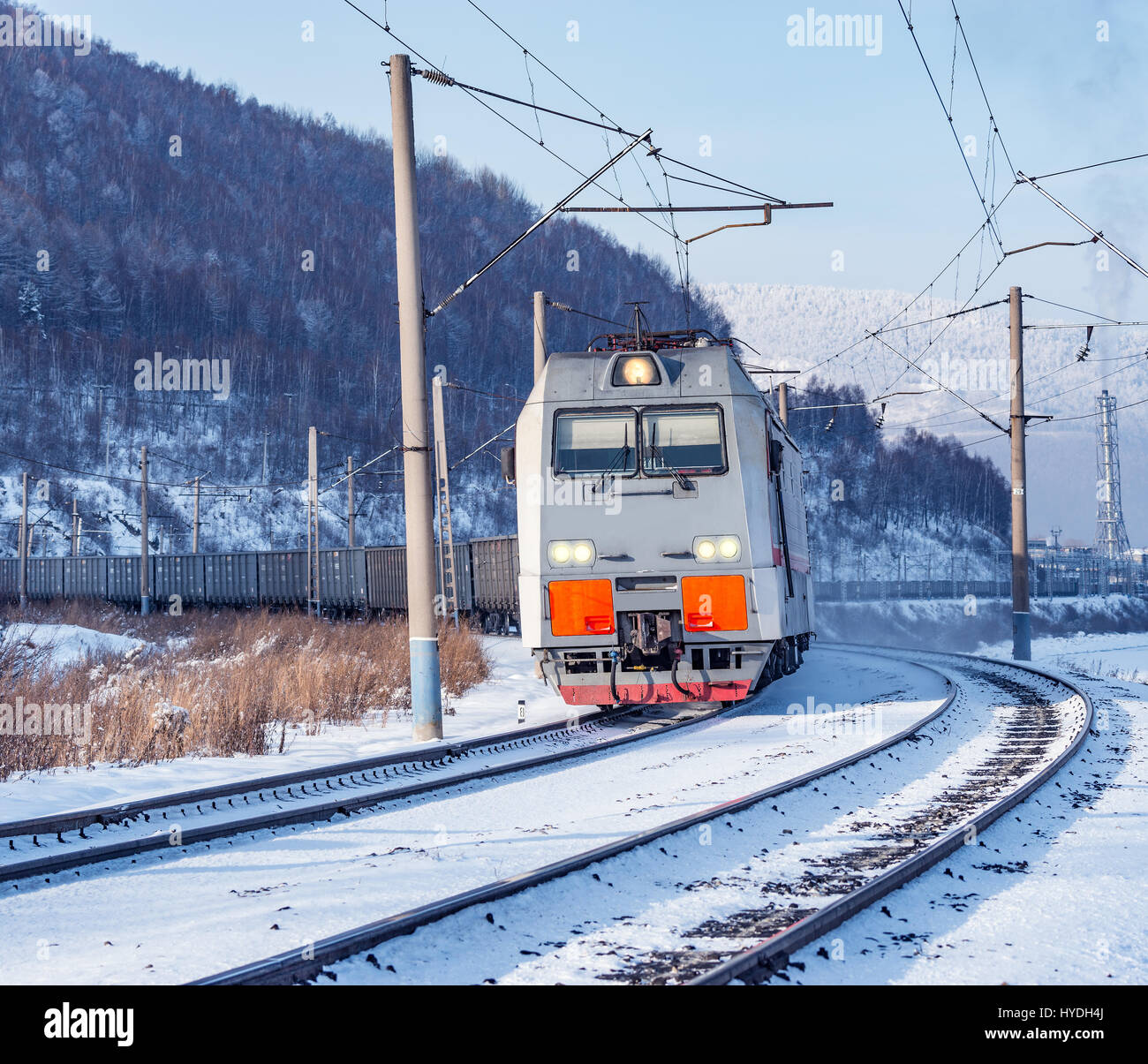 Freight train moves along Baikal lake. Trans Siberian railway. Russia ...