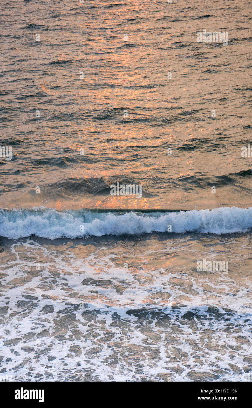 Sunset reflecting on the ocean surface Stock Photo - Alamy