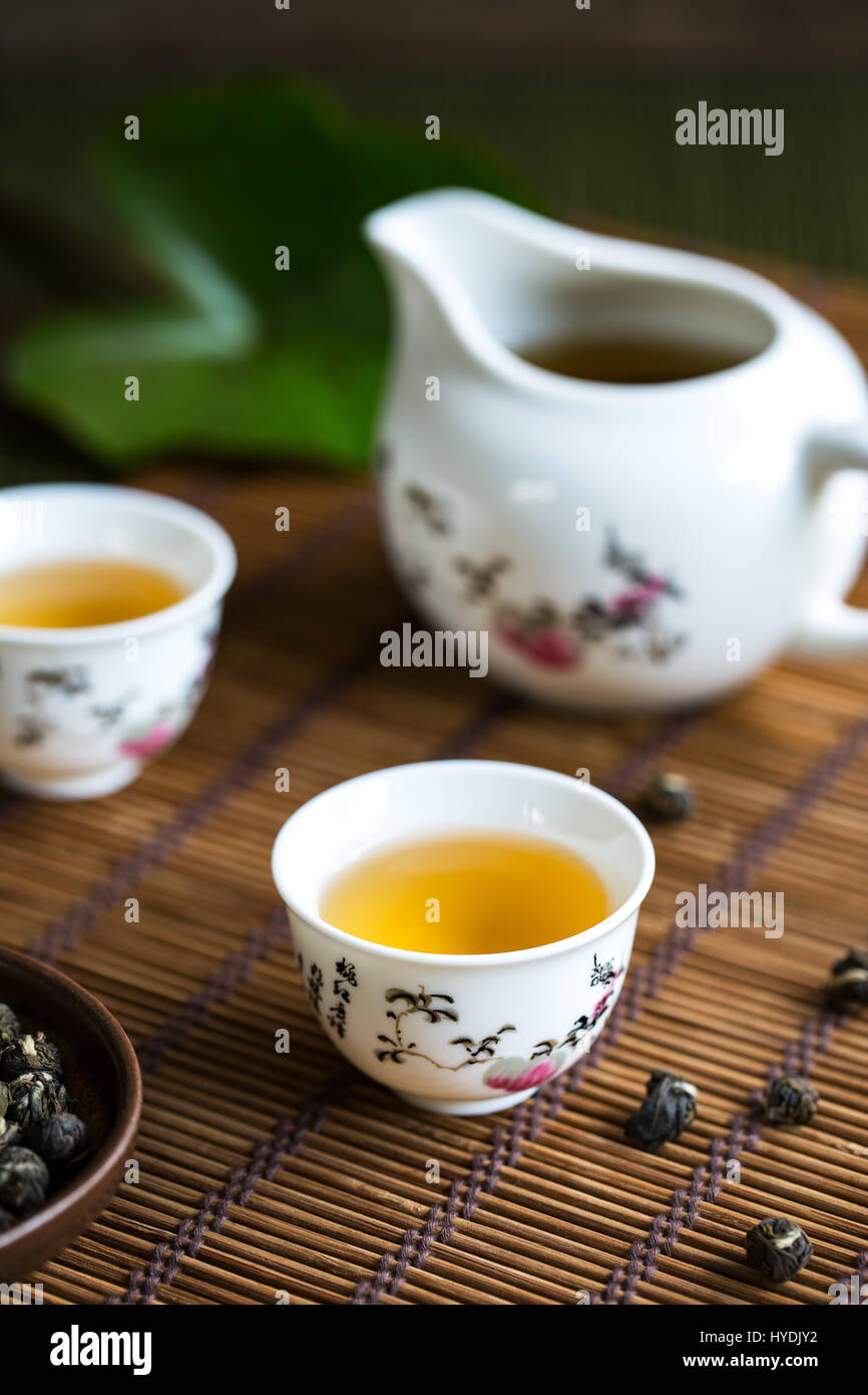 Hand rolled Chinese Pearl Jasmine Tea in traditional tea set Stock ...