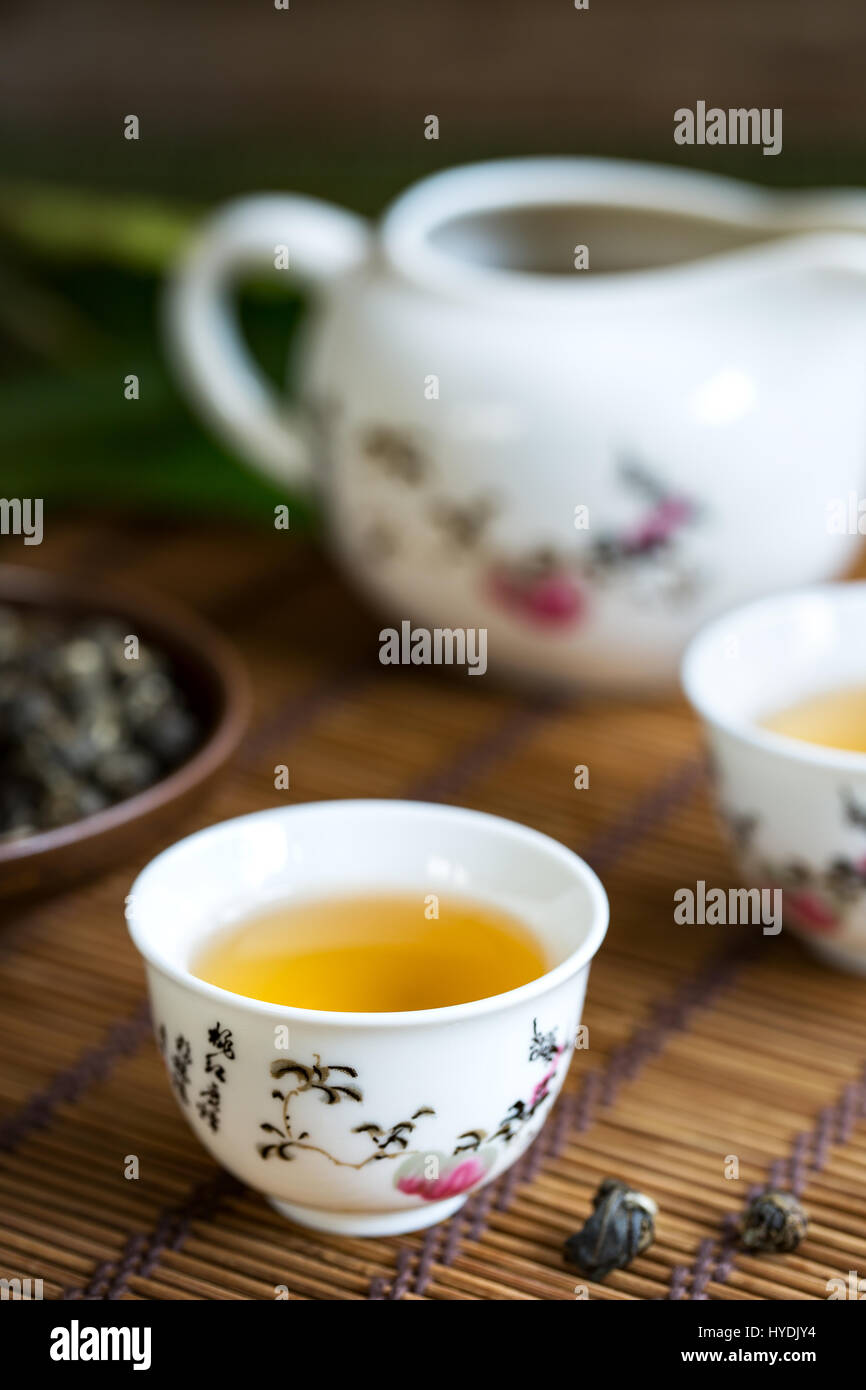 Hand rolled Chinese Pearl Jasmine Tea in traditional tea set Stock ...