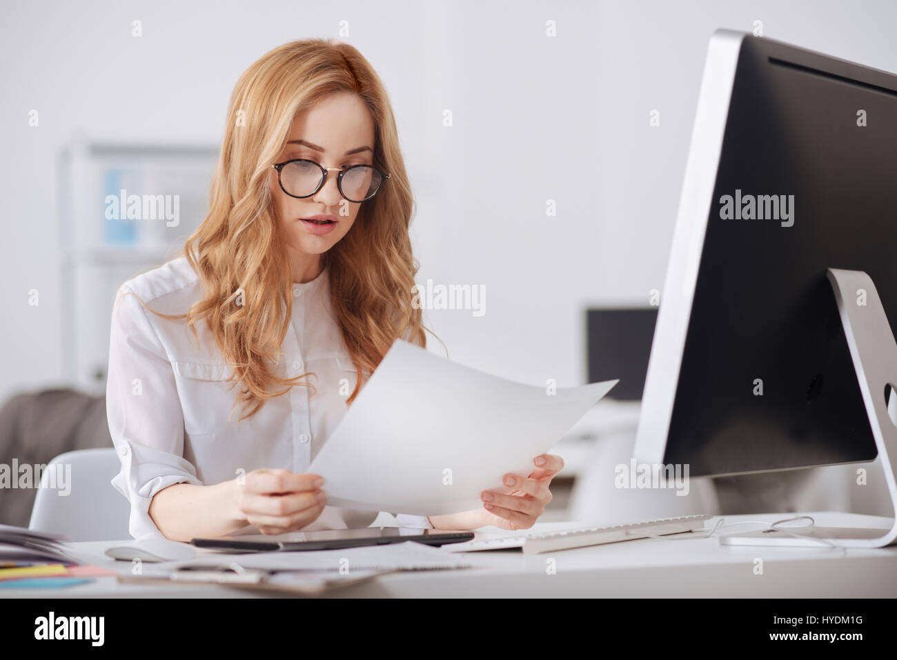 Busy young manager performing responsibilities at the workplace Stock ...