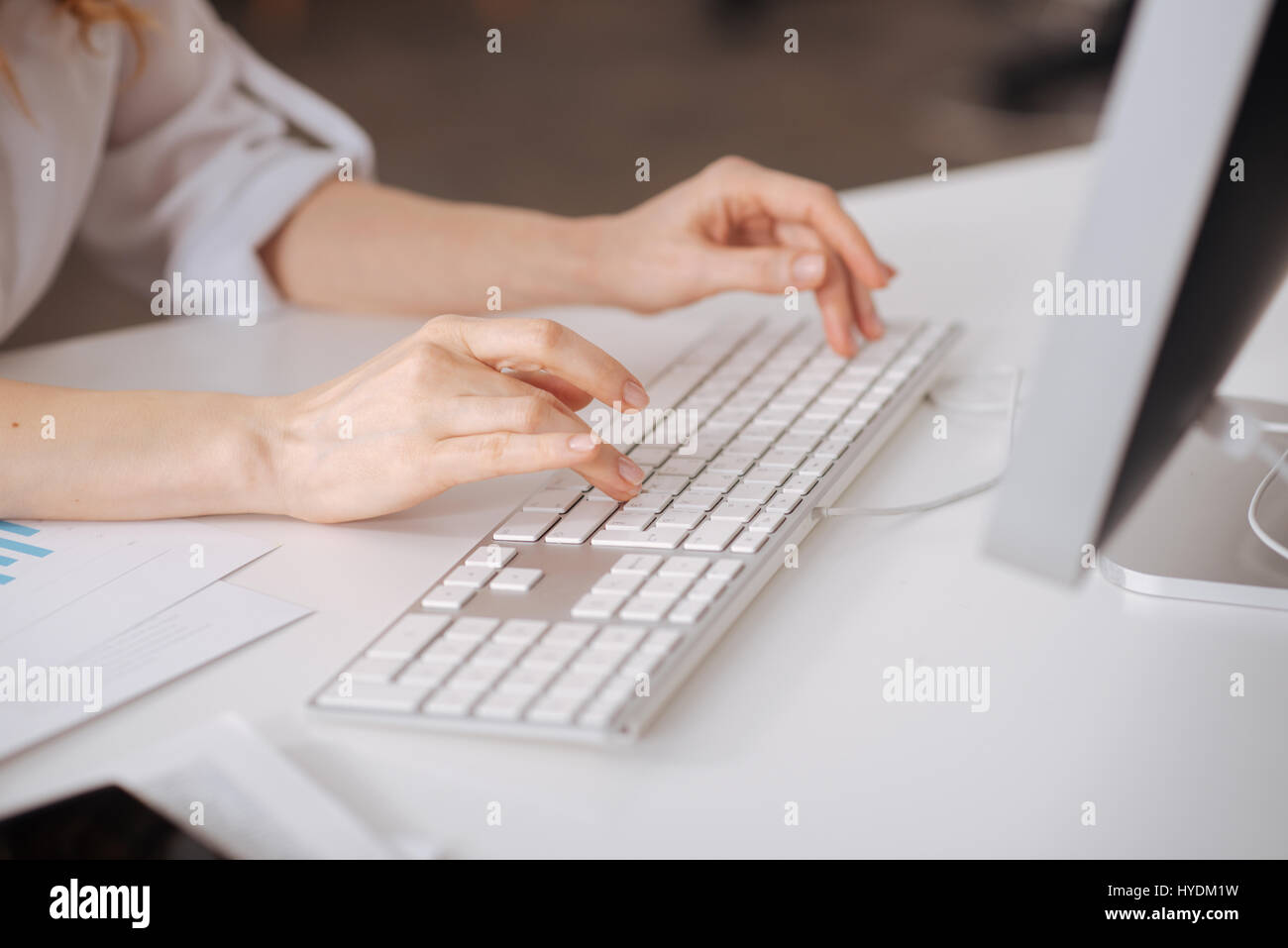 Hardworking young manager typing in the office Stock Photo - Alamy
