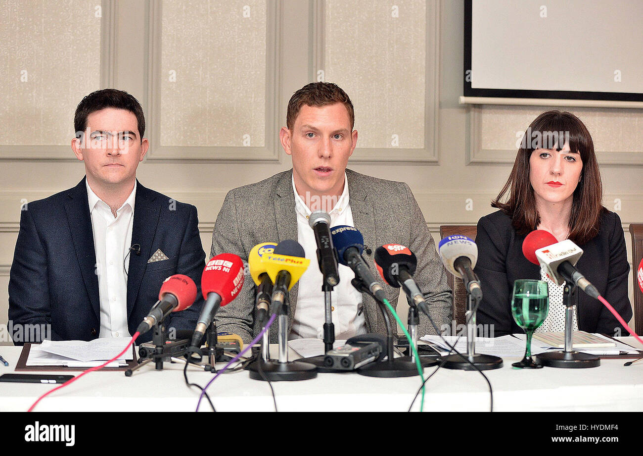 John McAreavey (centre), his sister Claire and Mark Harte, brother of ...
