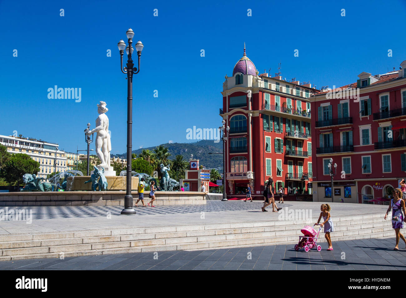 Fontaine du soleil fountain and statue of Apollo in Place Massena ...