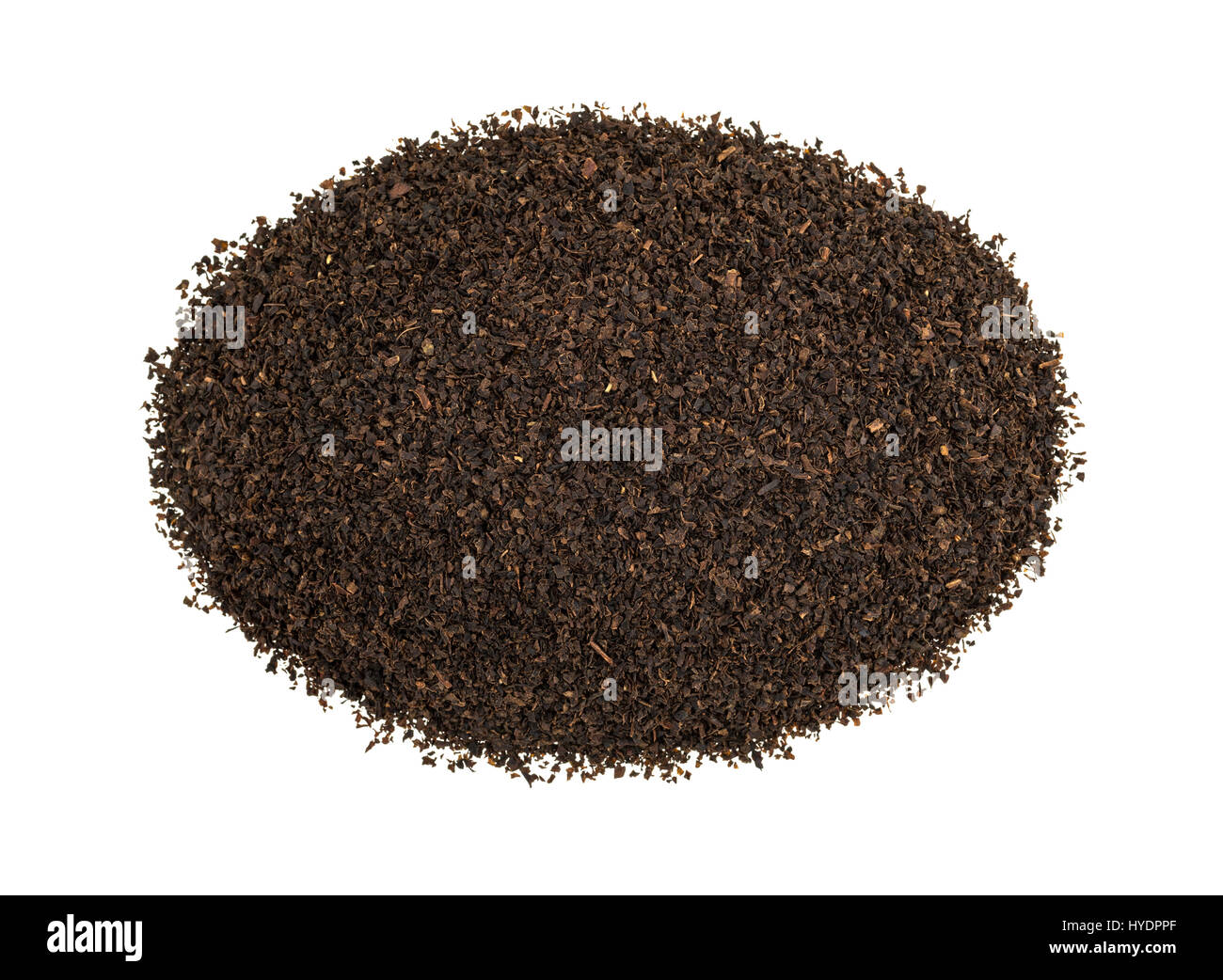 Top view of a small pile of loose leaf black tea isolated on a white ...
